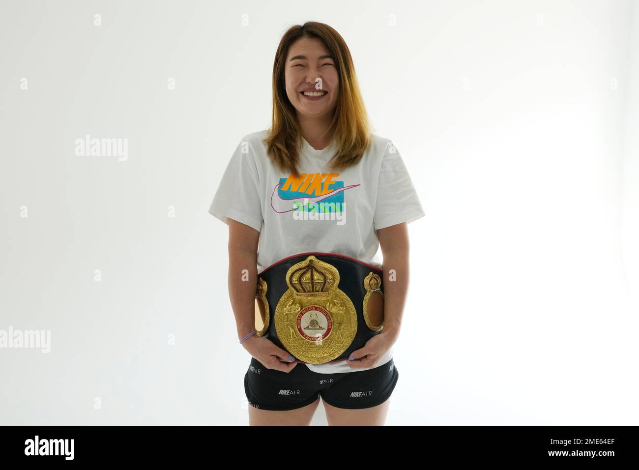 WBA woman super featherweight champion Choi Hyunmi smiles during an ...