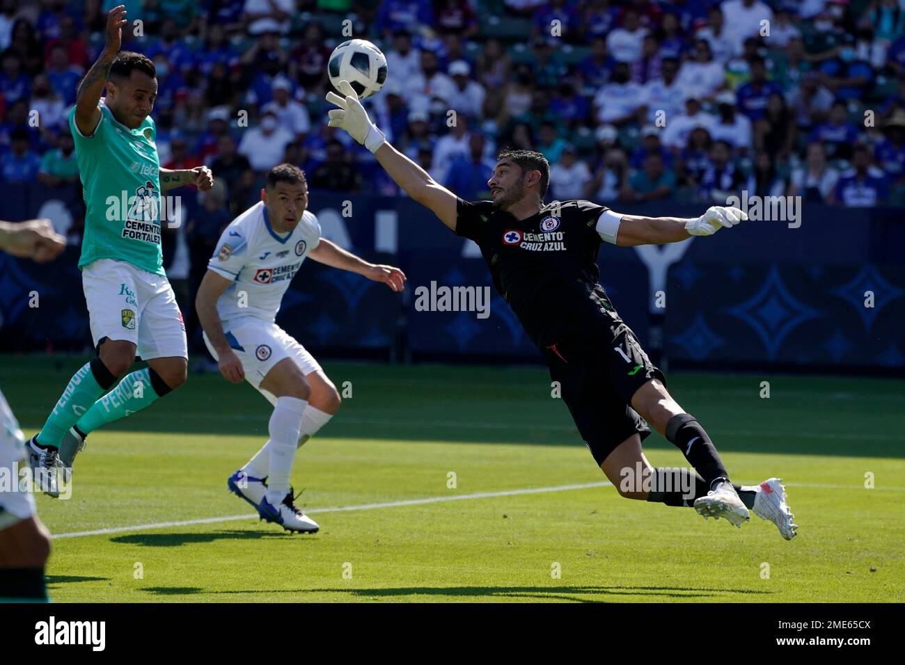 Cruz Azul goalkeeper Jesús Corona, right, makes a stop during the first ...
