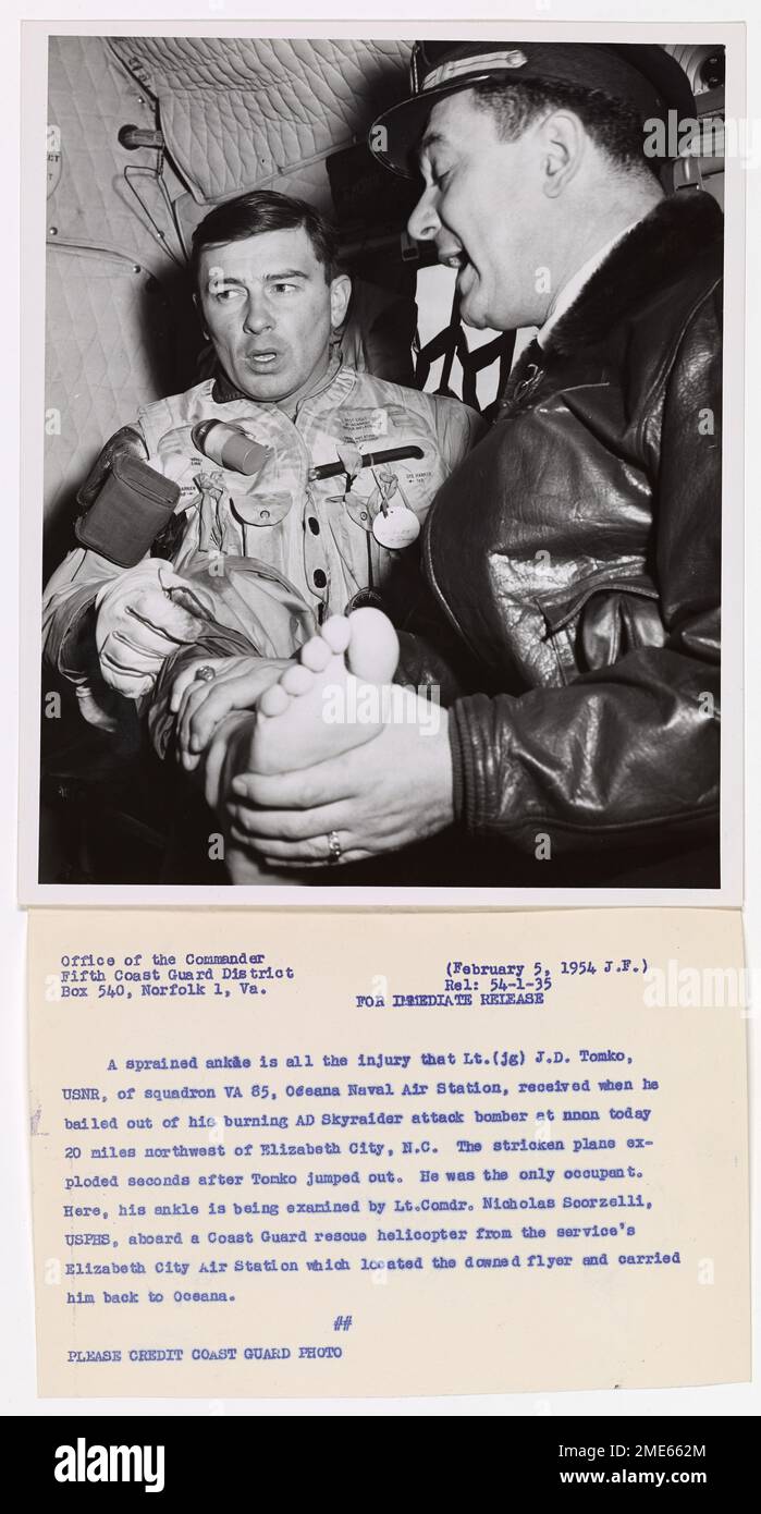 This image shows a Coast Guard helicopter rescuing Navy Lieutenant J.D ...