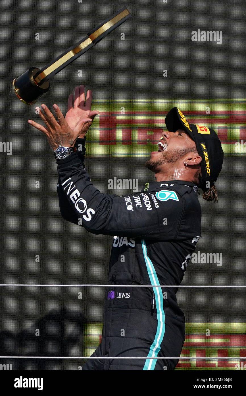 Mercedes driver Lewis Hamilton of Britain celebrates on the podium ...