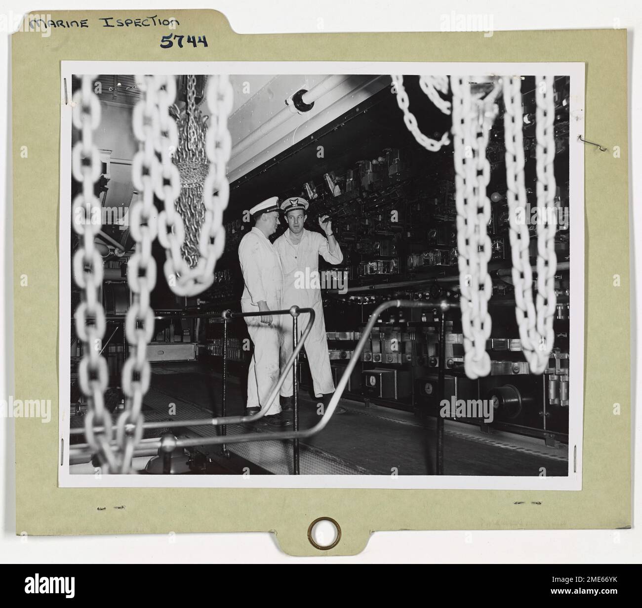 A U.S. Coast Guard inspector conducts a routine marine inspection on a ...