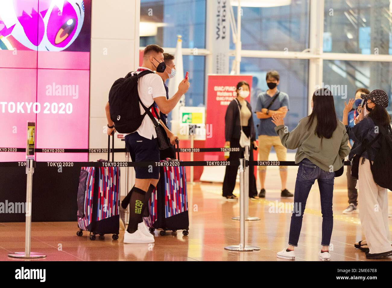 Japanese fans welcome Russian athletes as they arrive for the Tokyo ...