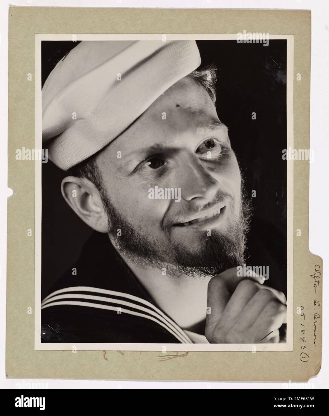 Coast Guardsman Clifton J. Brown, 22, is shown smiling with a beard ...