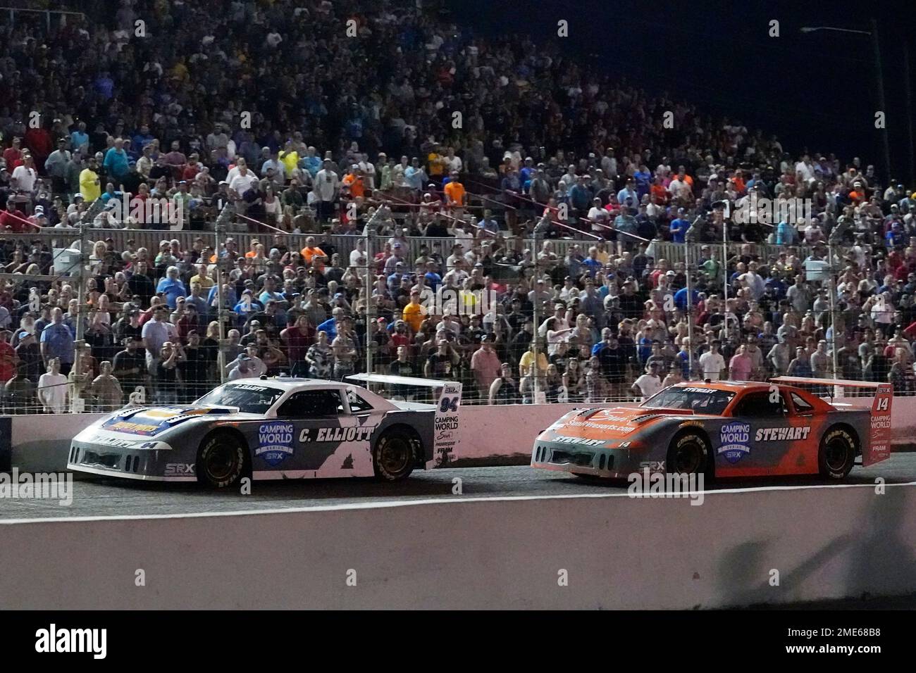 Chase Elliott (94) leads Tony Stewart during the SRX Series auto race ...