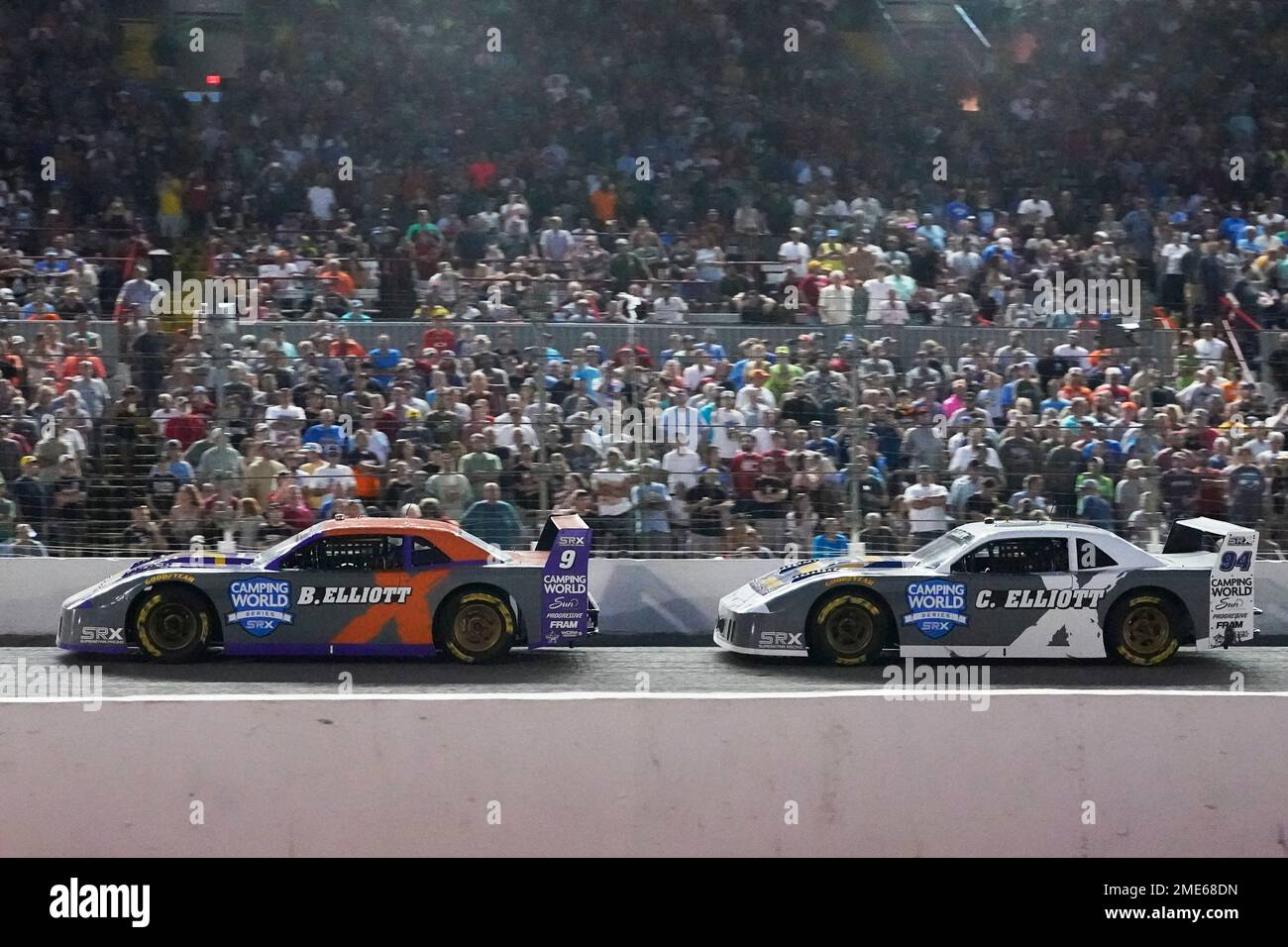 Bill Elliott (9) leads Chase Elliott during the SRX Series auto race ...