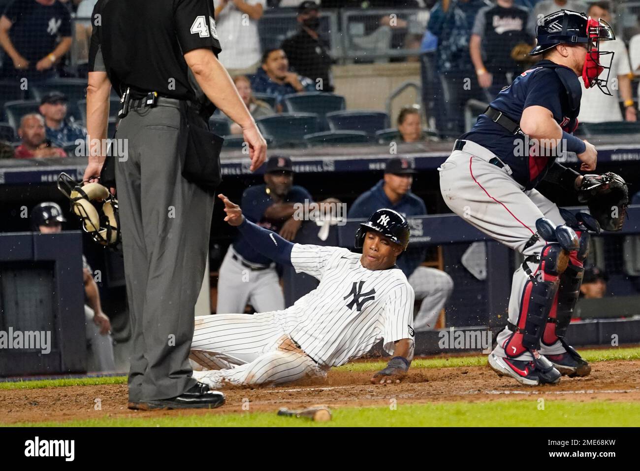 New York Yankees' Greg Allen, center, scores off a base hit by DJ ...