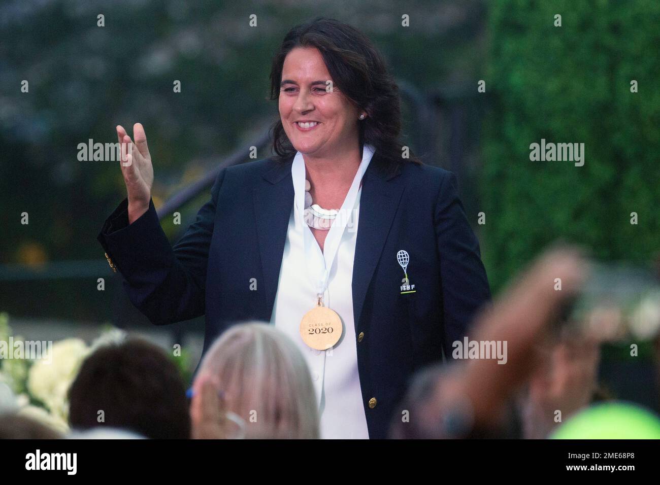 Conchita Martinez waves to the crowd after being inducted into the ...