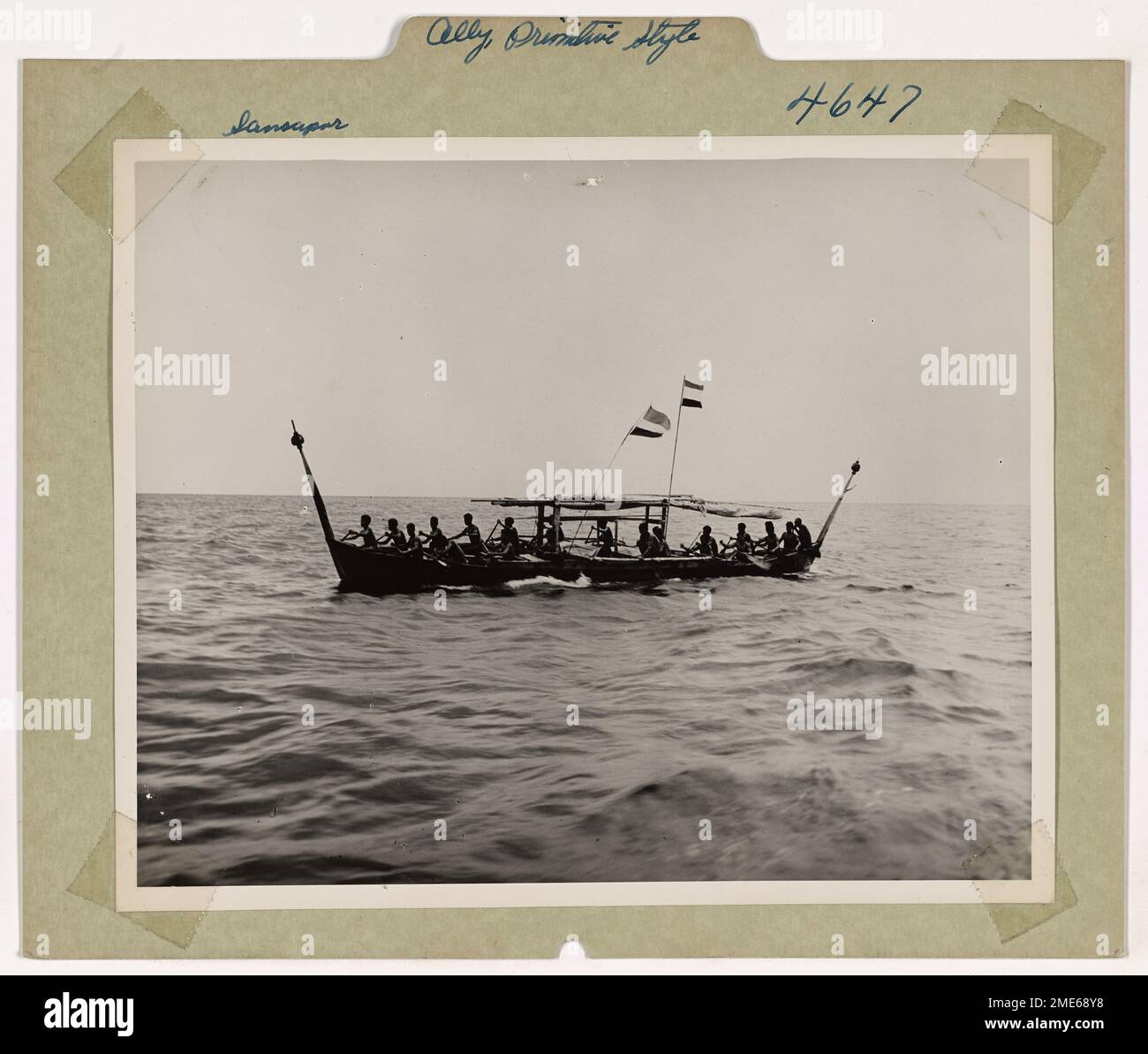 A native war canoe from Dutch New Guinea contrasts sharply with the ...