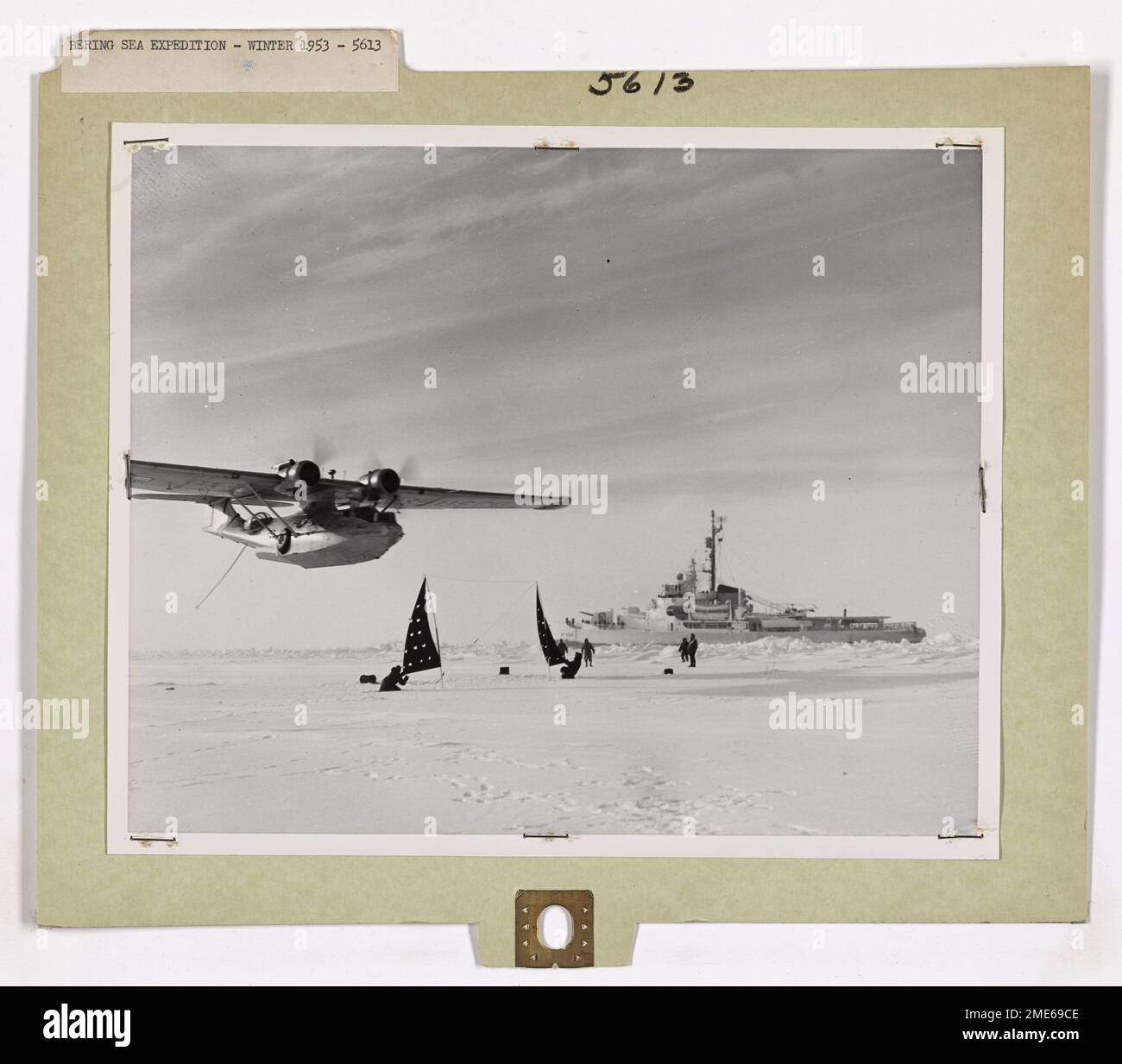 A Coast Guard PBY from Kodiak, Alaska, performs an aerial mail pickup ...