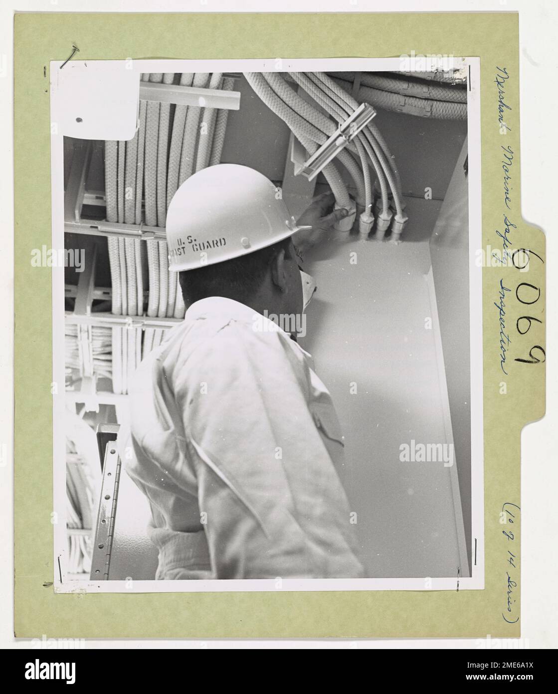 Coast Guard marine inspector Lieutenant Joel D. Sipes inspects the ...