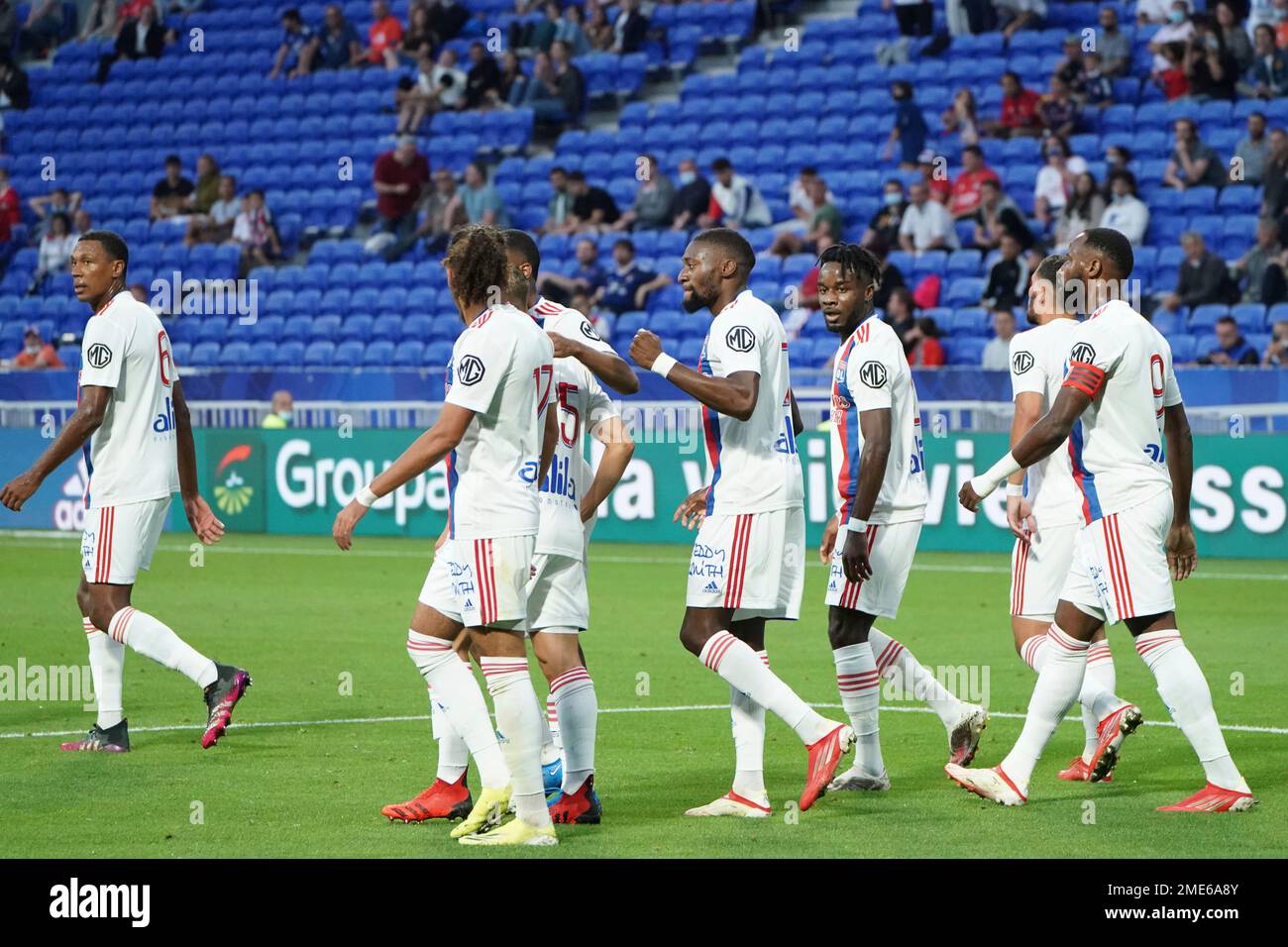 Lyon's Moussa Dembele, center, celebrates with his teammates after ...