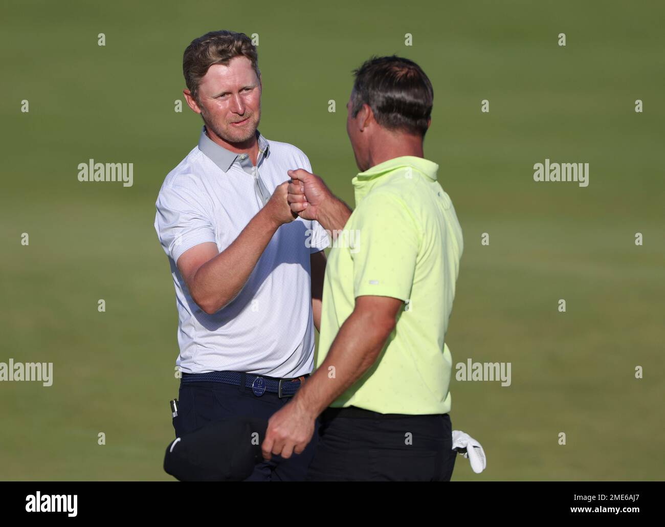 South Africa's Justin Harding, left bumps fists with England's Paul ...