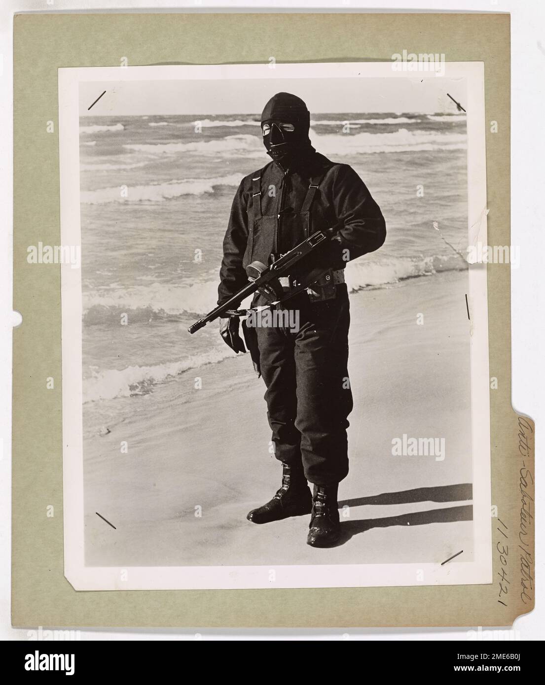 A Coast Guardsman scans the horizon for enemy spies and saboteurs ...