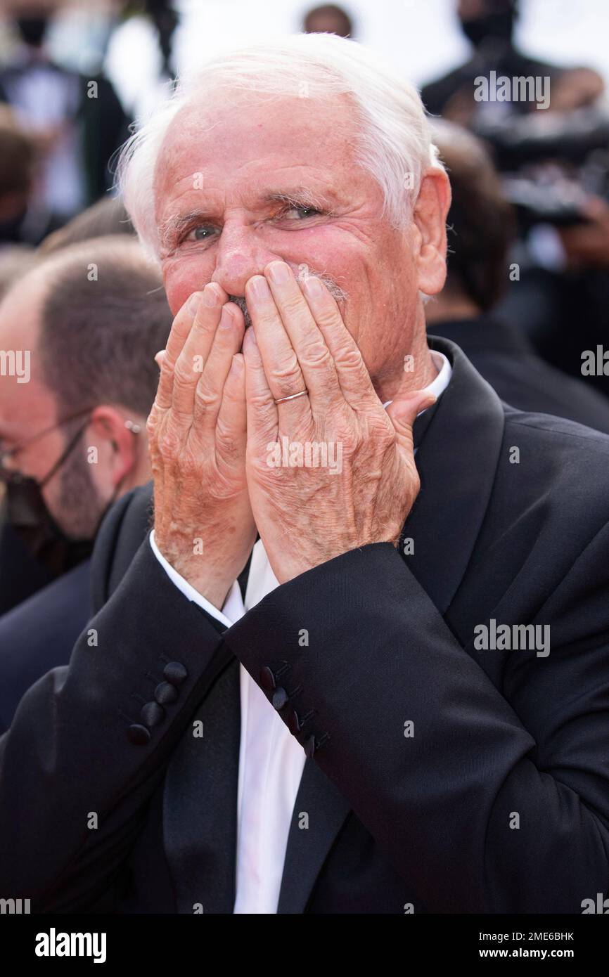 Yann Arthus-Bertrand poses for photographers upon arrival at the ...