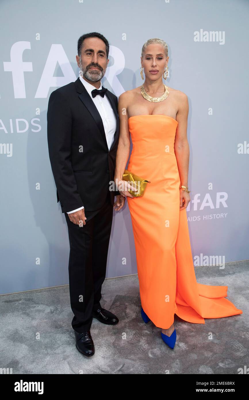 Amir Shariat and Kennedy Yanko pose for photographers upon arrival at the amfAR Cinema Against ...