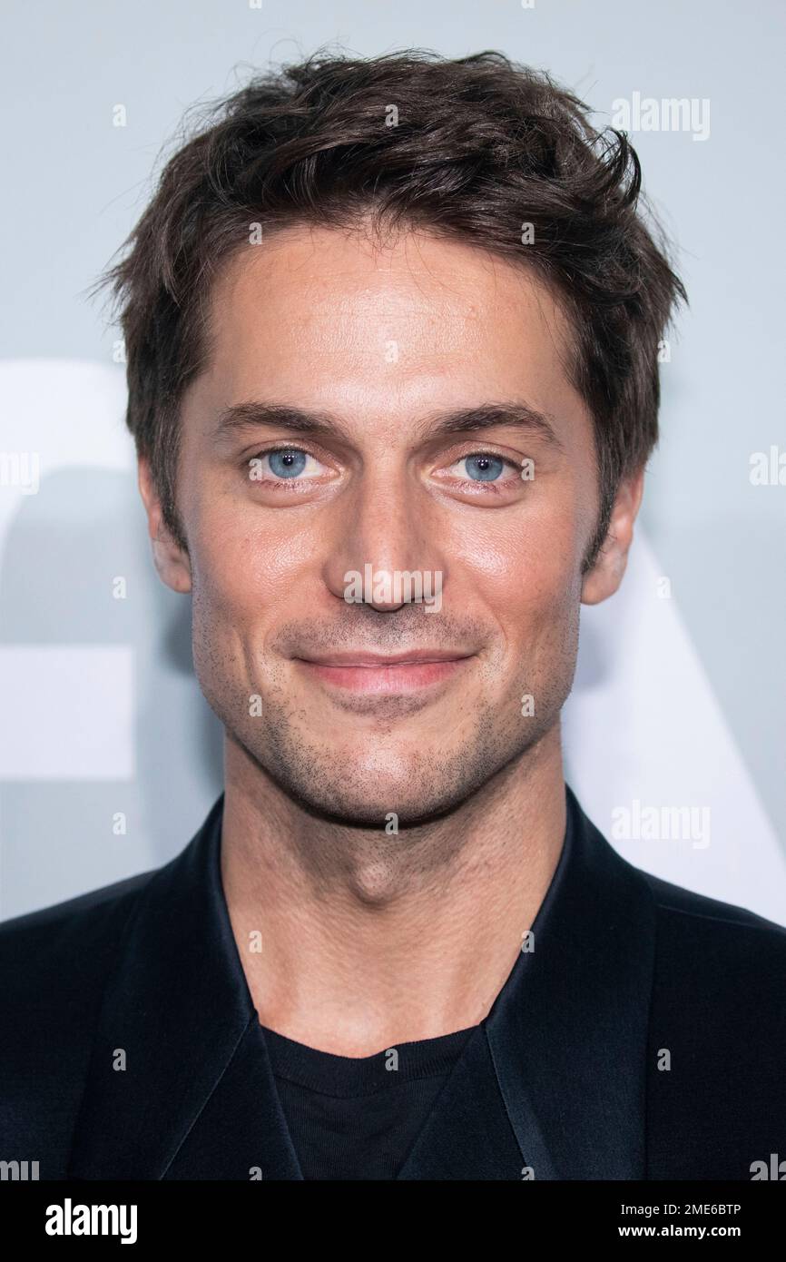 Lucas Bravo poses for photographers upon arrival at the amfAR Cinema ...