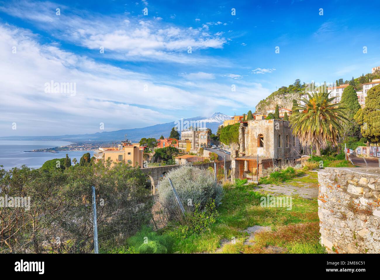 Etna volcano and Taormina town aerial panoramic view. Roofs of a lot of ...
