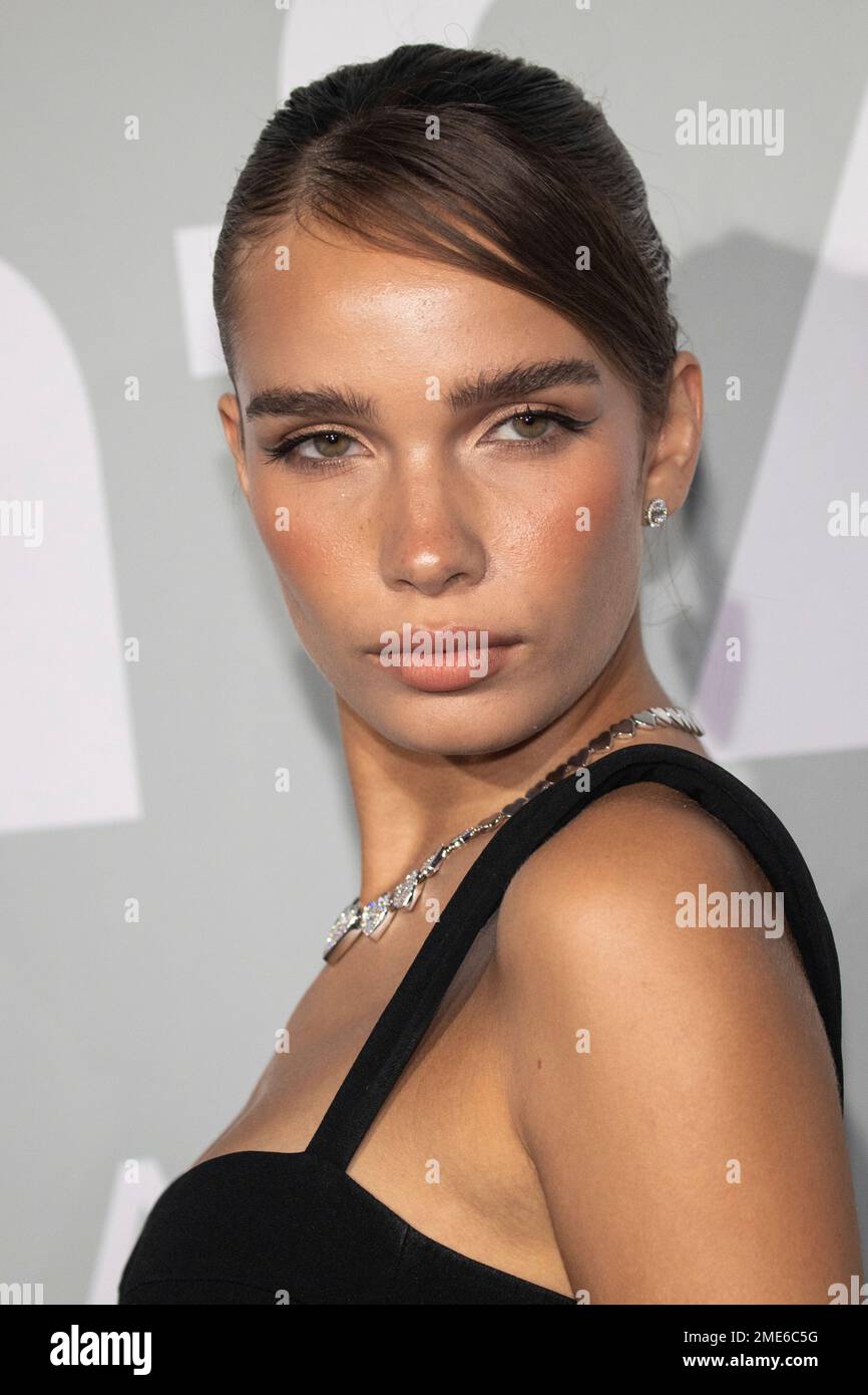 Hana Cross poses for photographers upon arrival at the amfAR Cinema ...