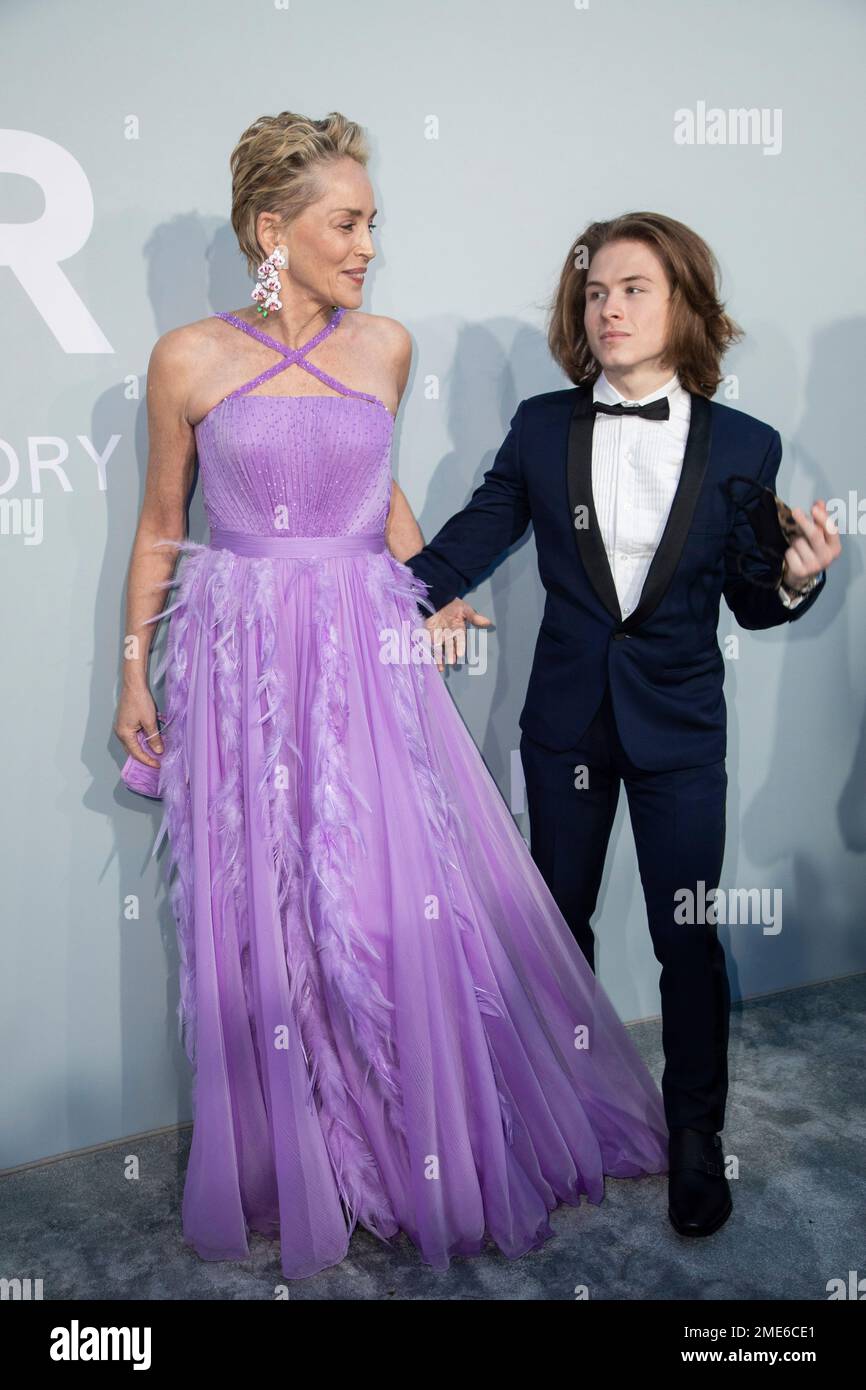 Sharon Stone, left, and Roan Joseph Bronstein pose for photographers ...