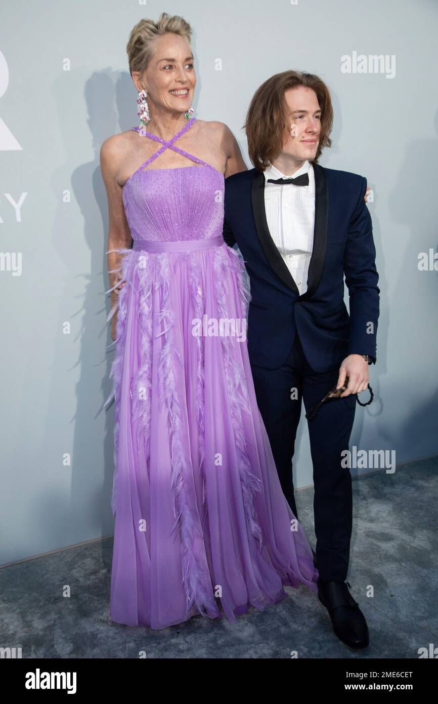 Sharon Stone, left, and Roan Joseph Bronstein pose for photographers ...