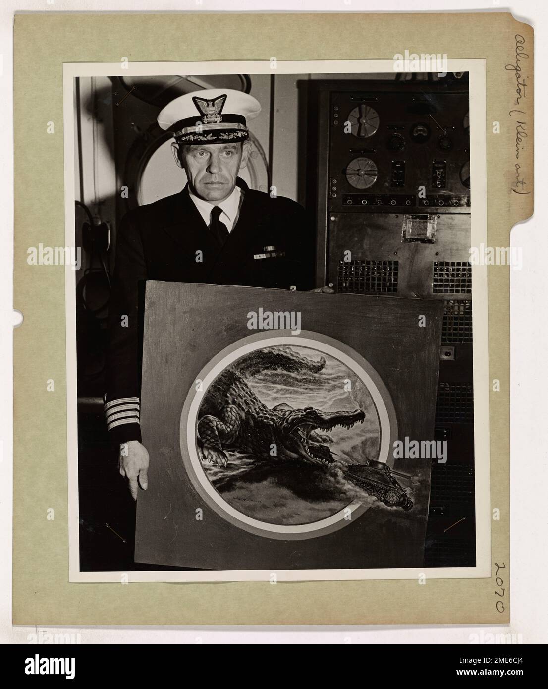A Coast Guard Captain, D.C. McNeil, displays an unofficial insignia ...