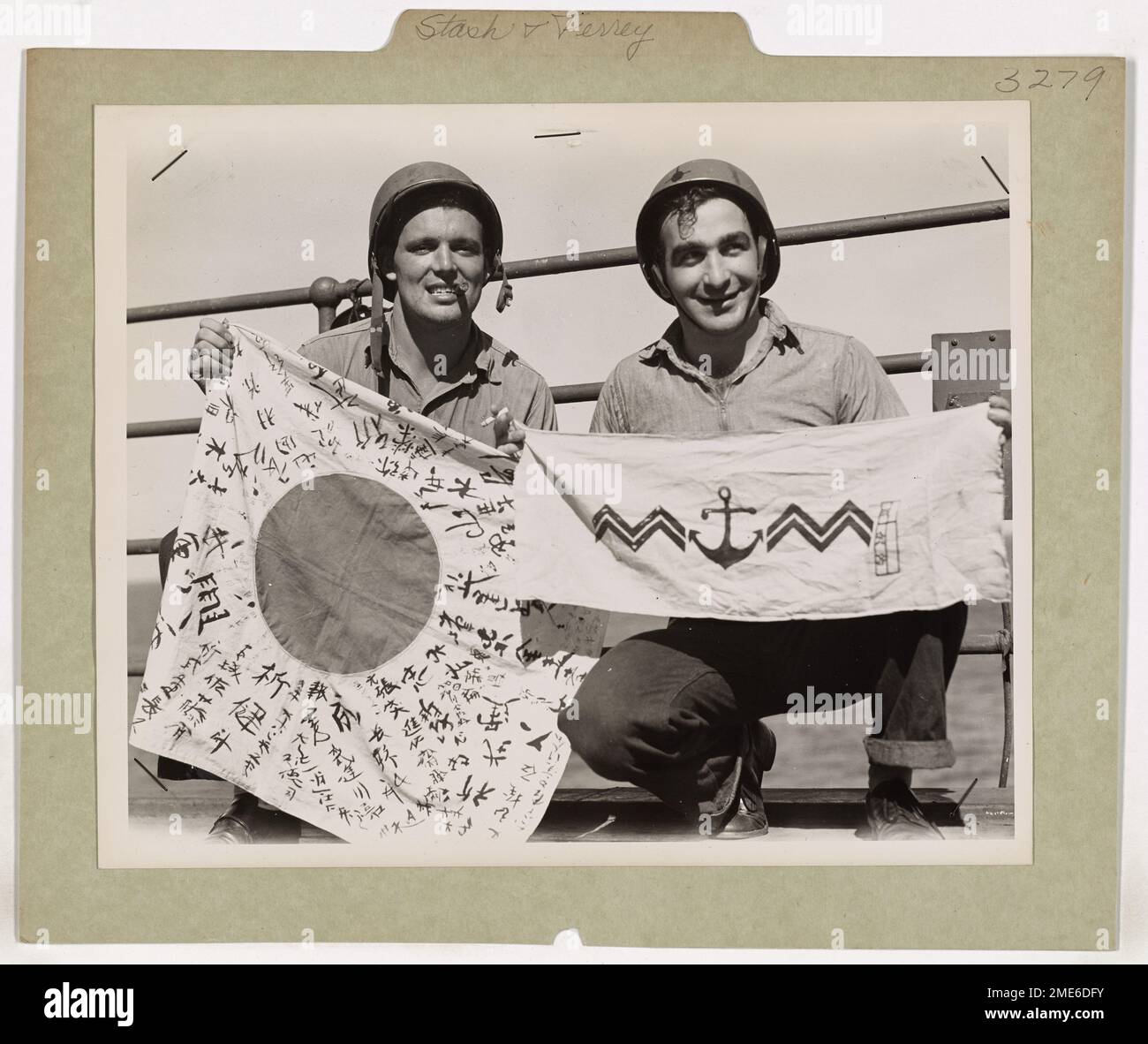 Photograph of Coast Guardsmen Exhibiting Captured Japanese Flags. Jap ...