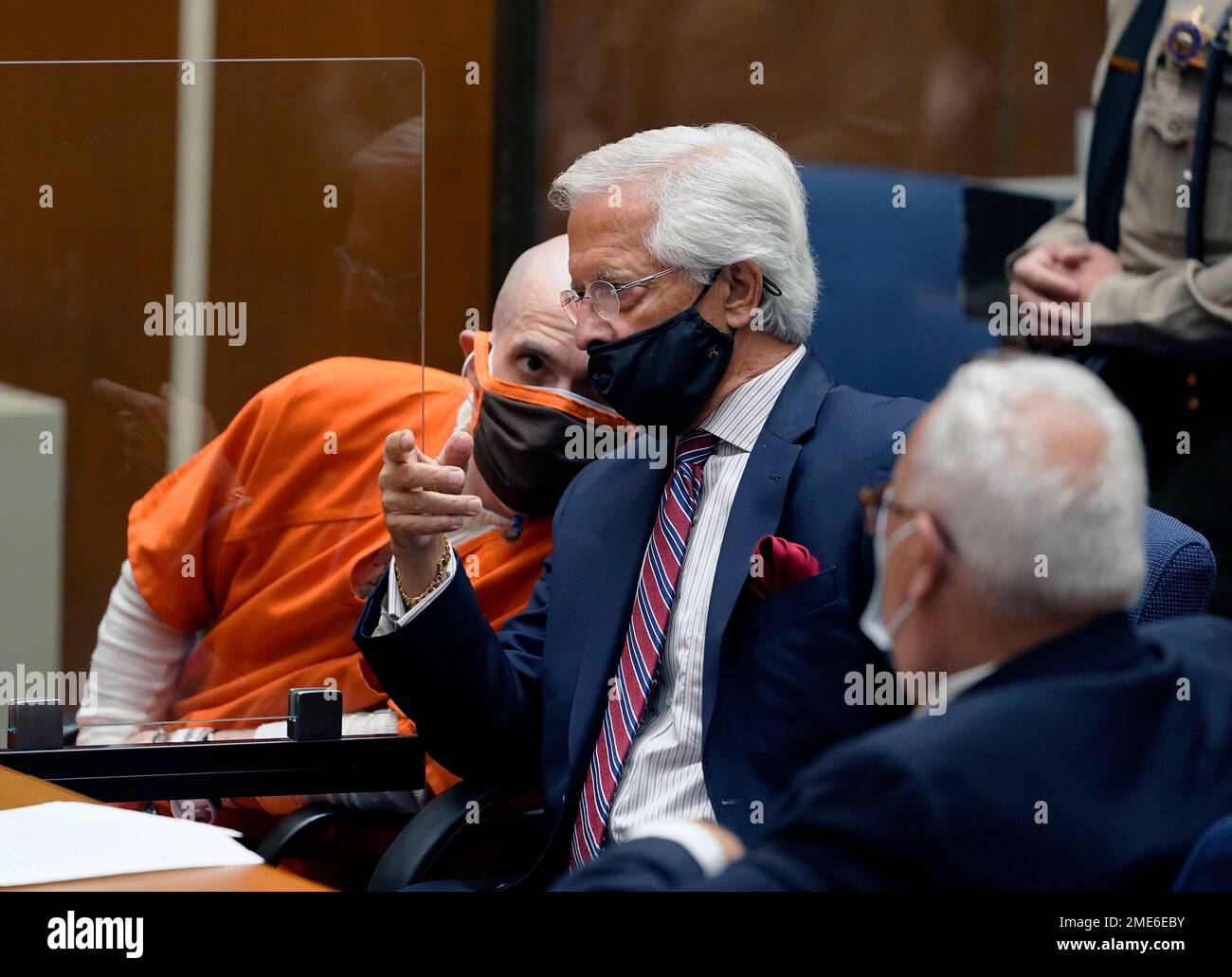Michael Thomas Gargiulo, left, talks to his defense attorneys, Daniel ...