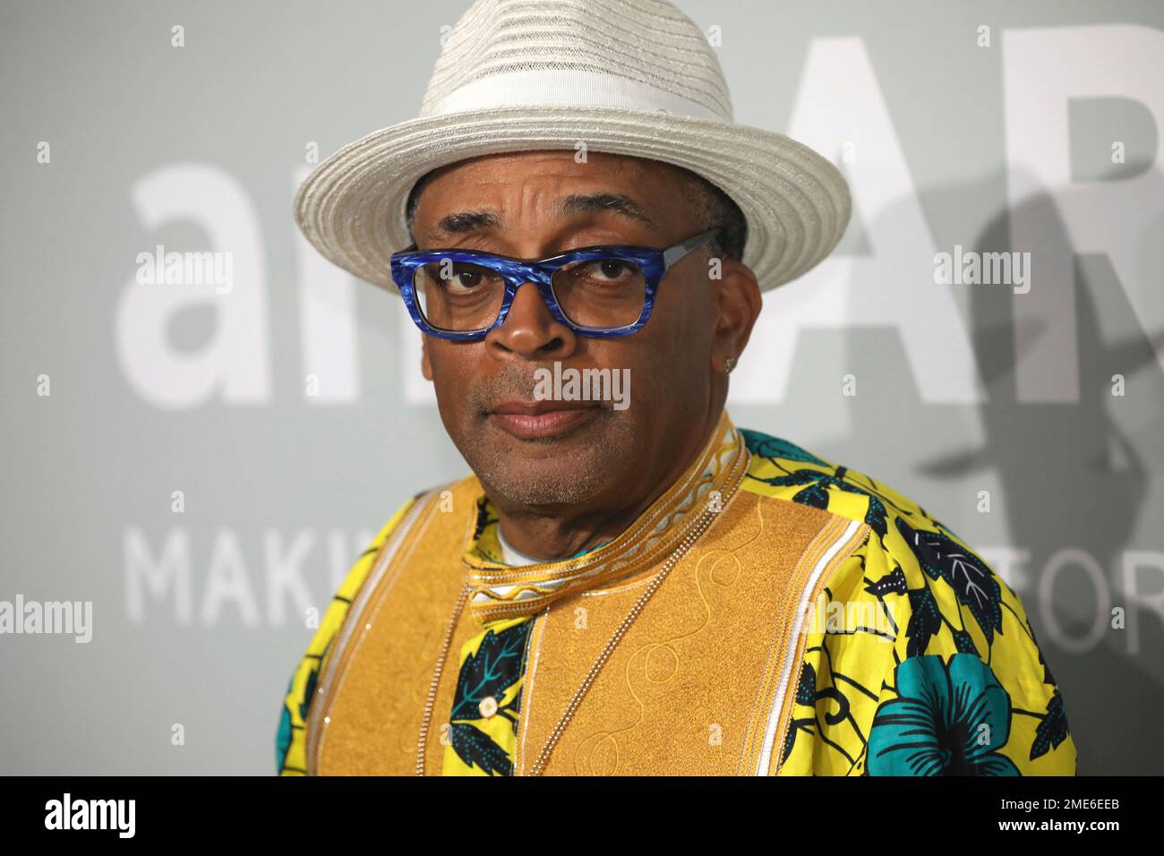 Spike Lee poses for photographers upon arrival at the amfAR Cinema ...