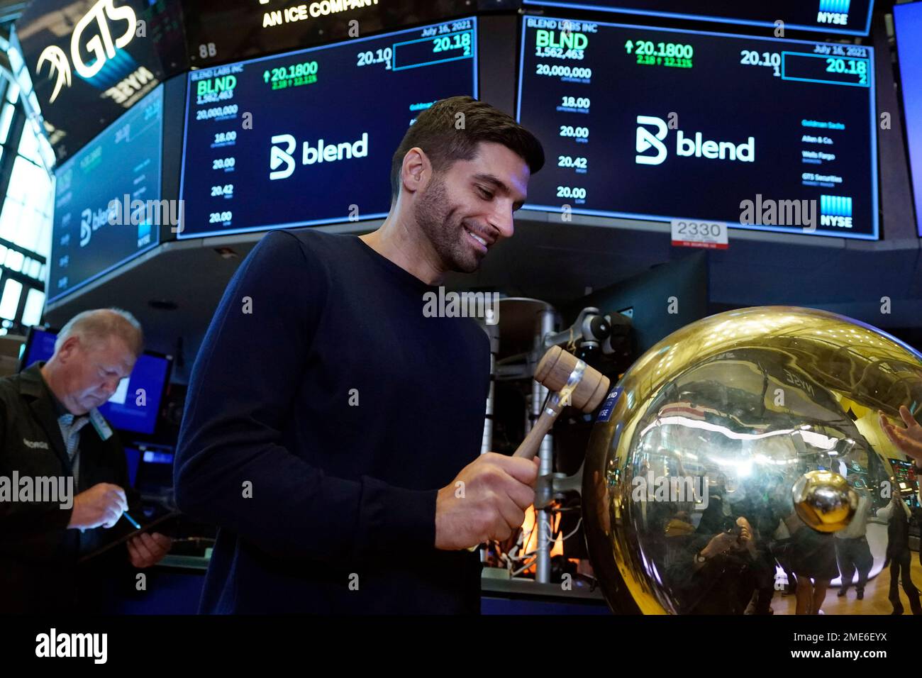 Head of Blend and co-founder Nima Ghamsarion rings a ceremonial bell as ...