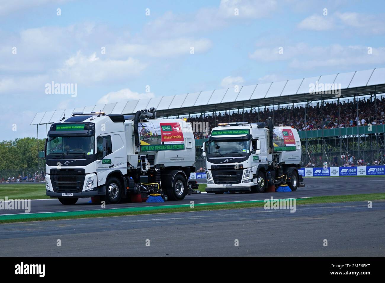Trucks clean the track before the first free practice session ahead of ...