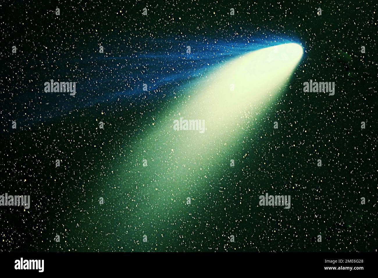Green comet in dark space. Elements of this image furnished by NASA ...