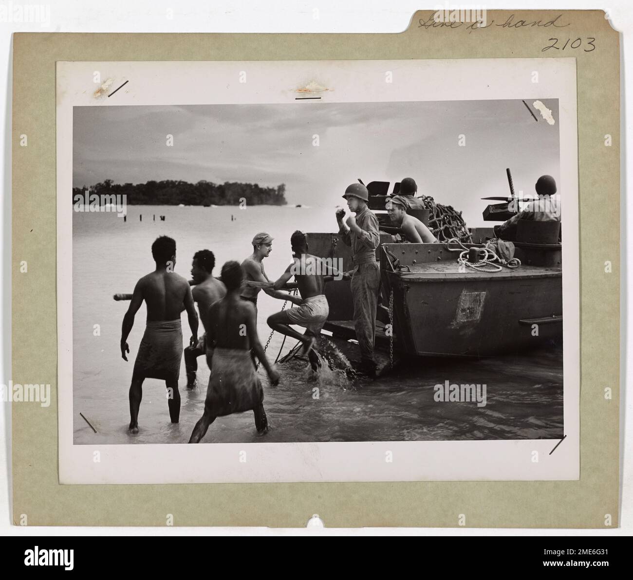 Polynesians Give the Invaders a Hand. A Coast Guard landing craft ...