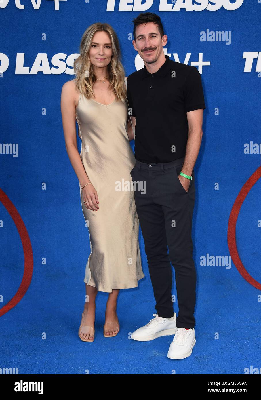 Sacha Kljestan, right, and Jamie Lee Darley arrive at the premiere of ...