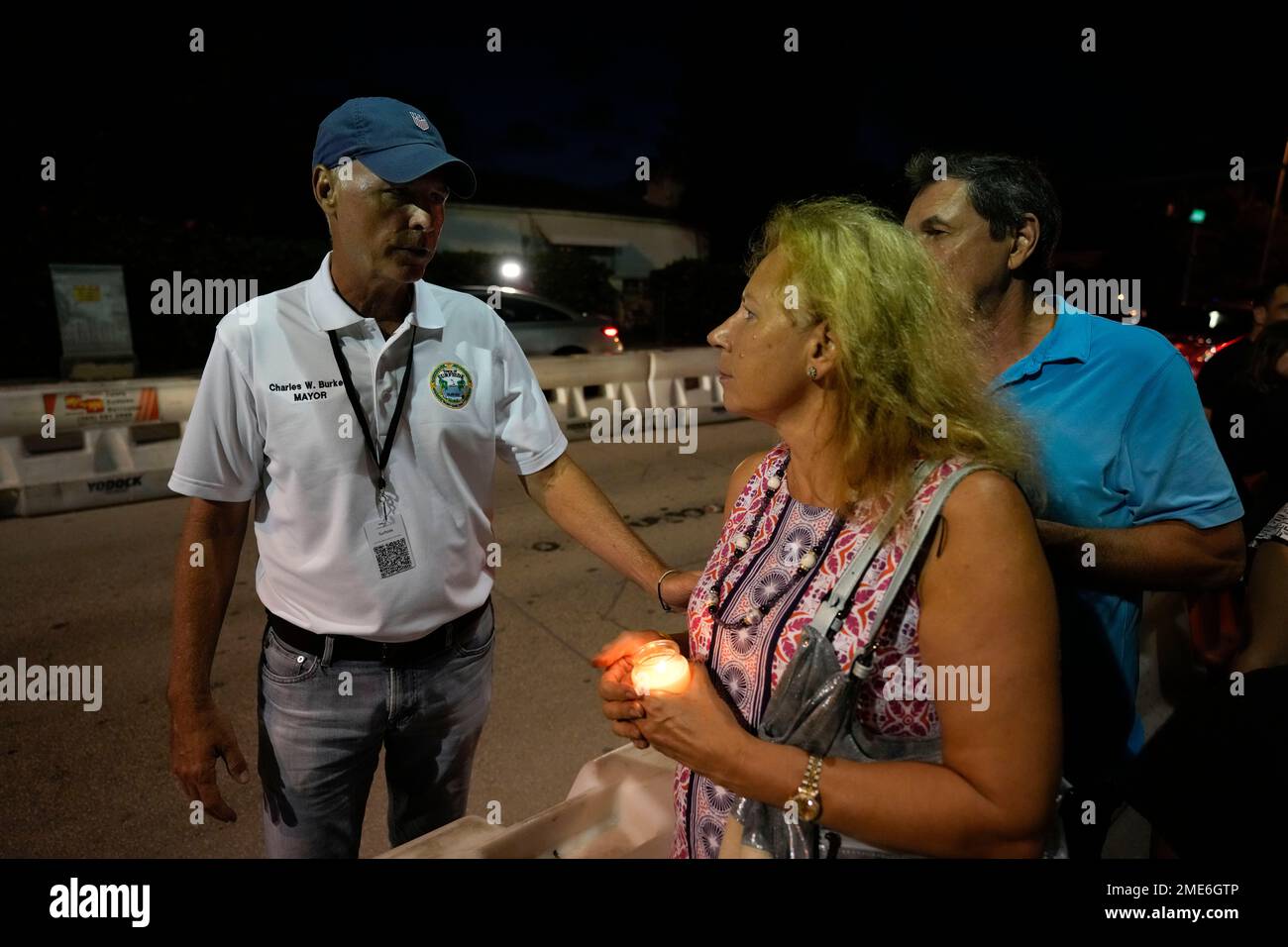 Surfside Mayor Charles Burkett, left, greets an acquaintance from the ...
