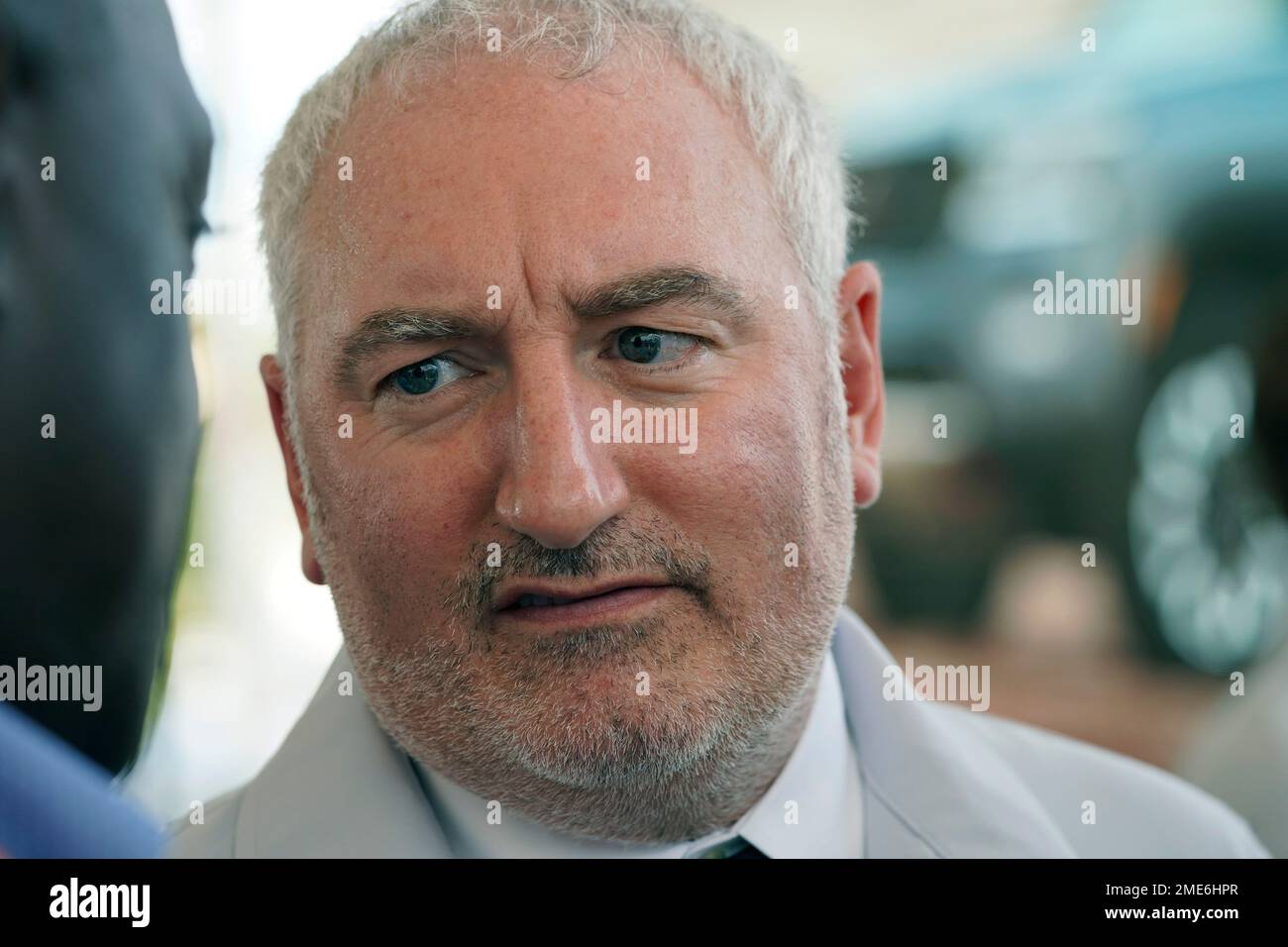 Jérémie Papin, chairperson of Nissan Americas, speaks with an attendee ...