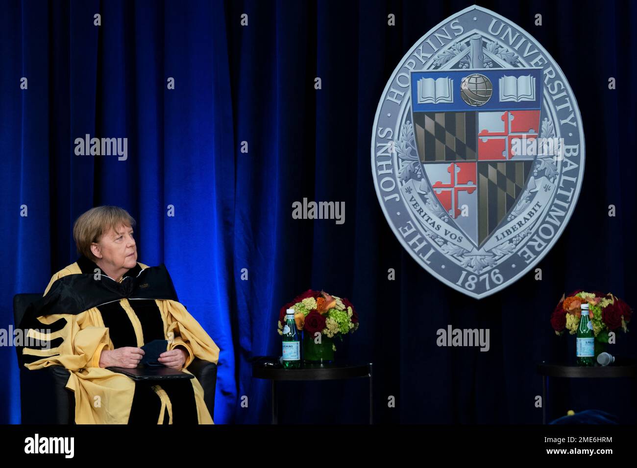 German Chancellor Angela Merkel listens during a ceremony awarding ...