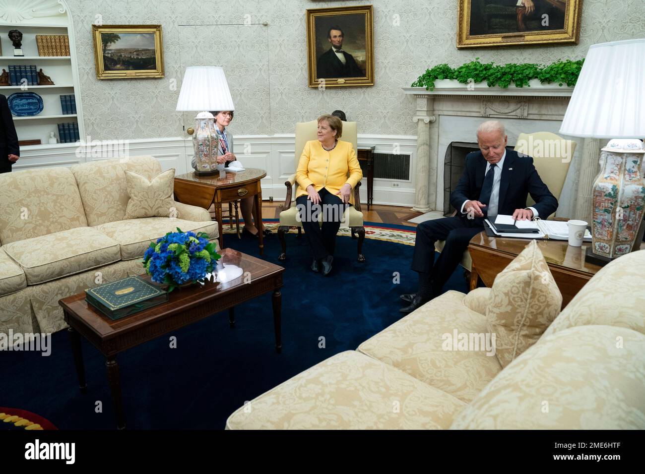German Chancellor Angela Merkel sits in the Oval Office during a ...
