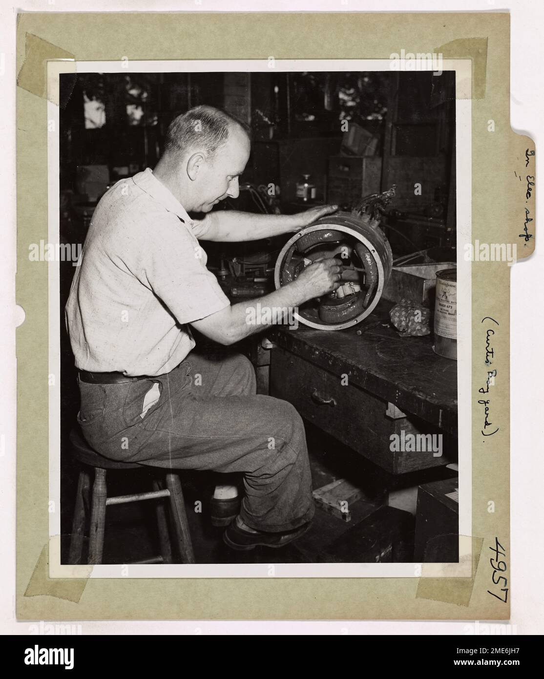 This image depicts an electrician painting the field of an electric ...