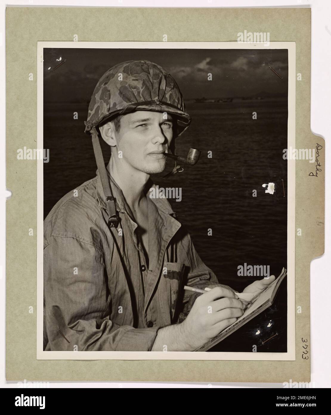 Seaman Max Dorthy, a Coast Guard combat artist, sketches the invasion ...