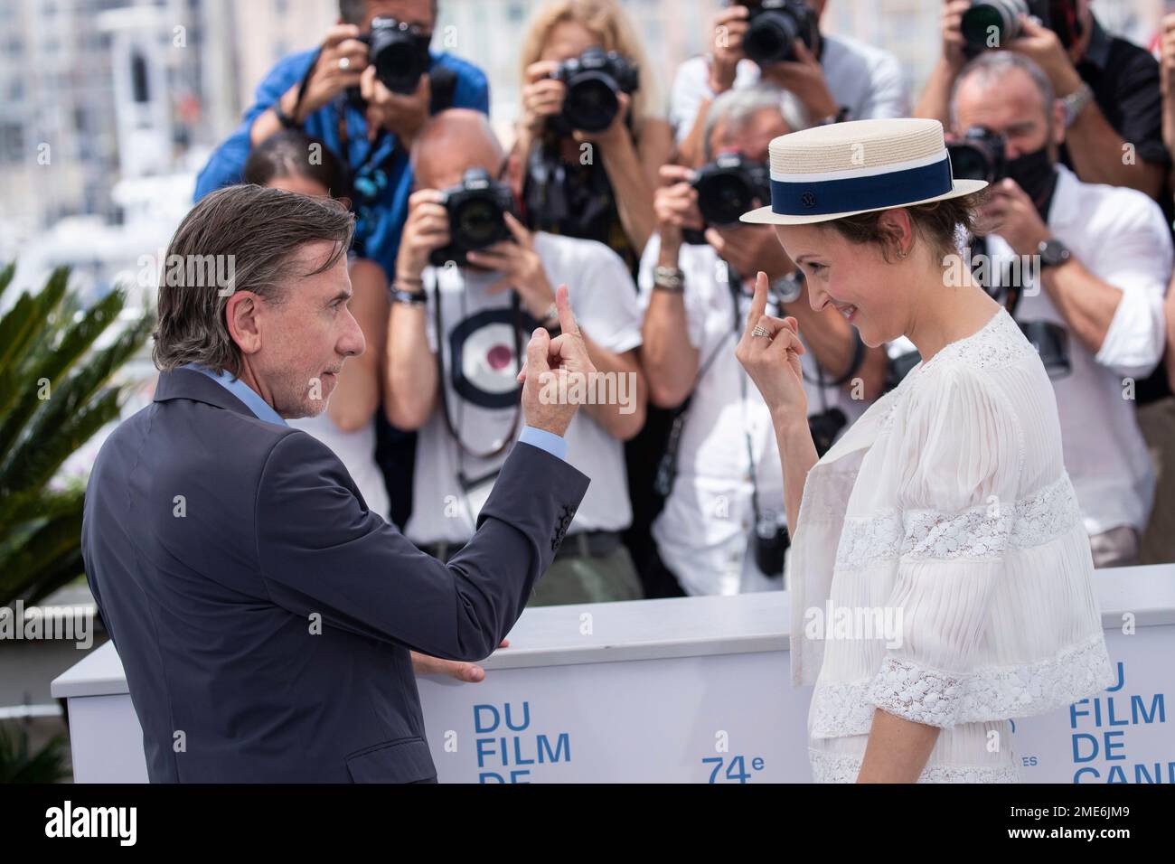 Tim Roth, left, and Vicky Krieps pose for photographers at the photo ...