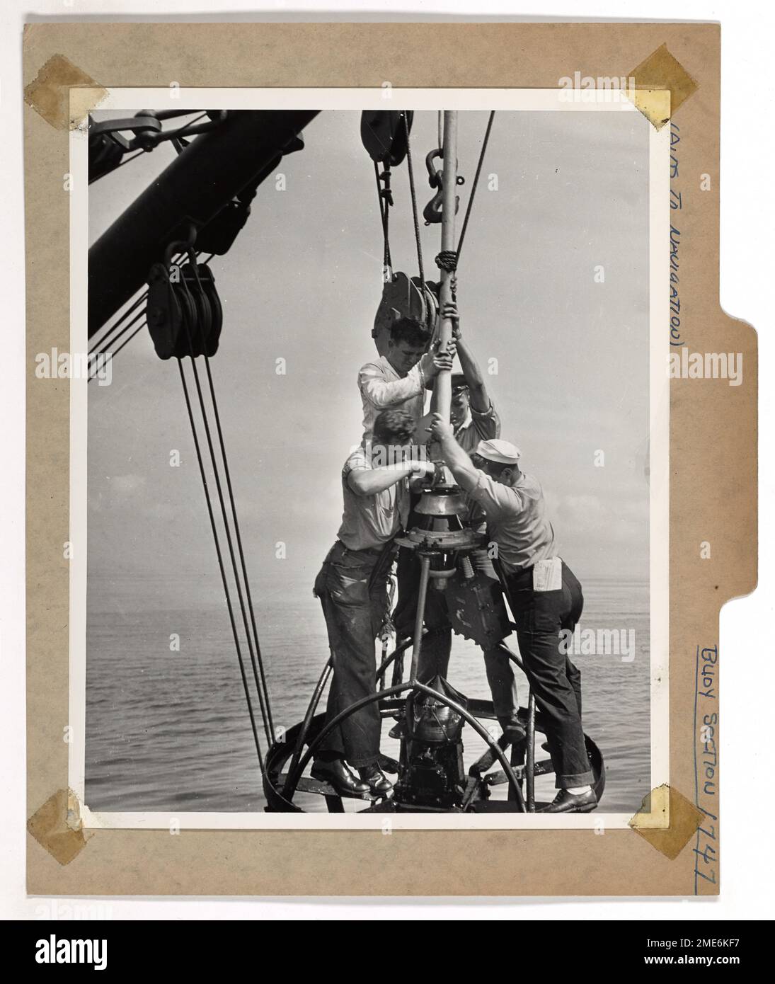 A Coast Guard team installs the antenna for a radio beacon, a vital ...