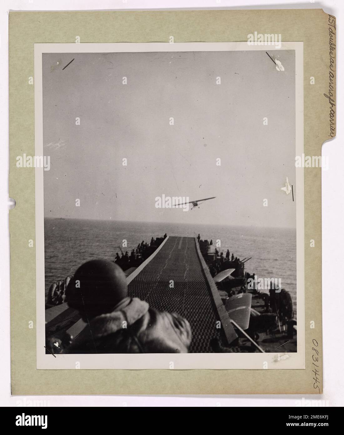 An LST (Landing Ship Tank) is shown serving as a temporary aircraft ...