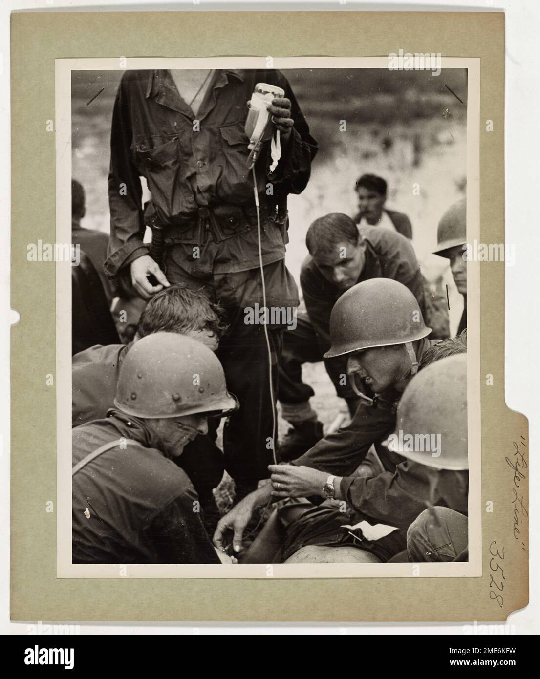 A fallen American soldier on Leyte Island receives plasma from Army and ...