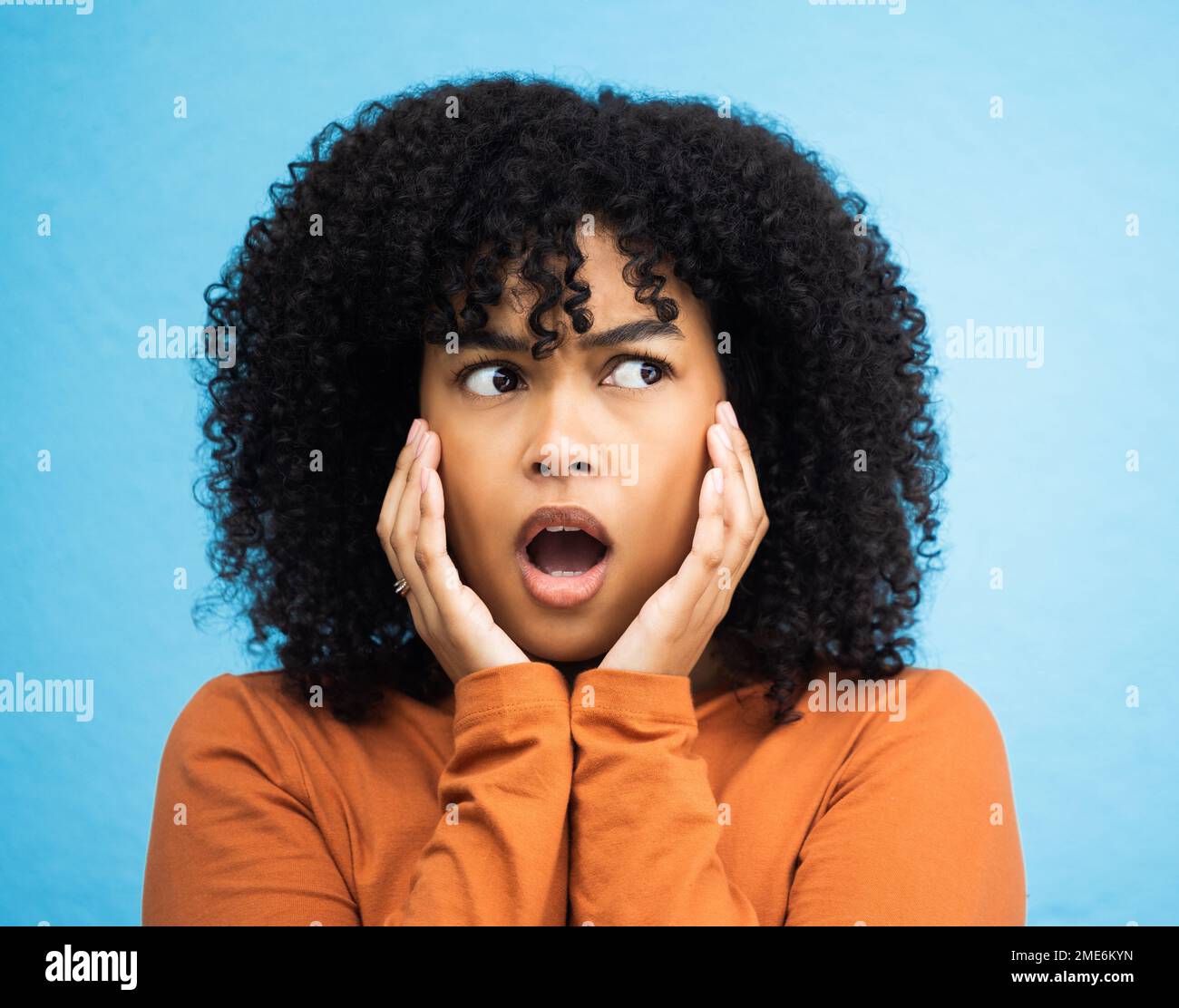 Wow, surprise and thinking with a black woman in shock standing on a ...