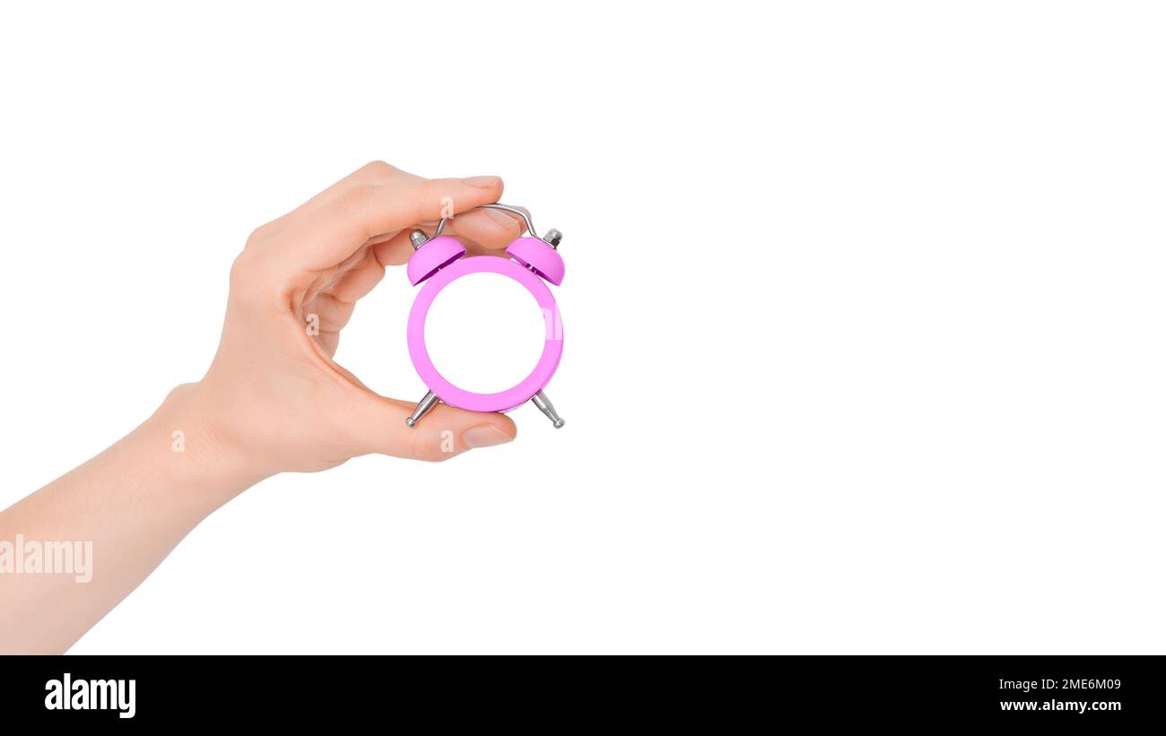 Hand holding beautiful small pink alarm clock isolated on white ...