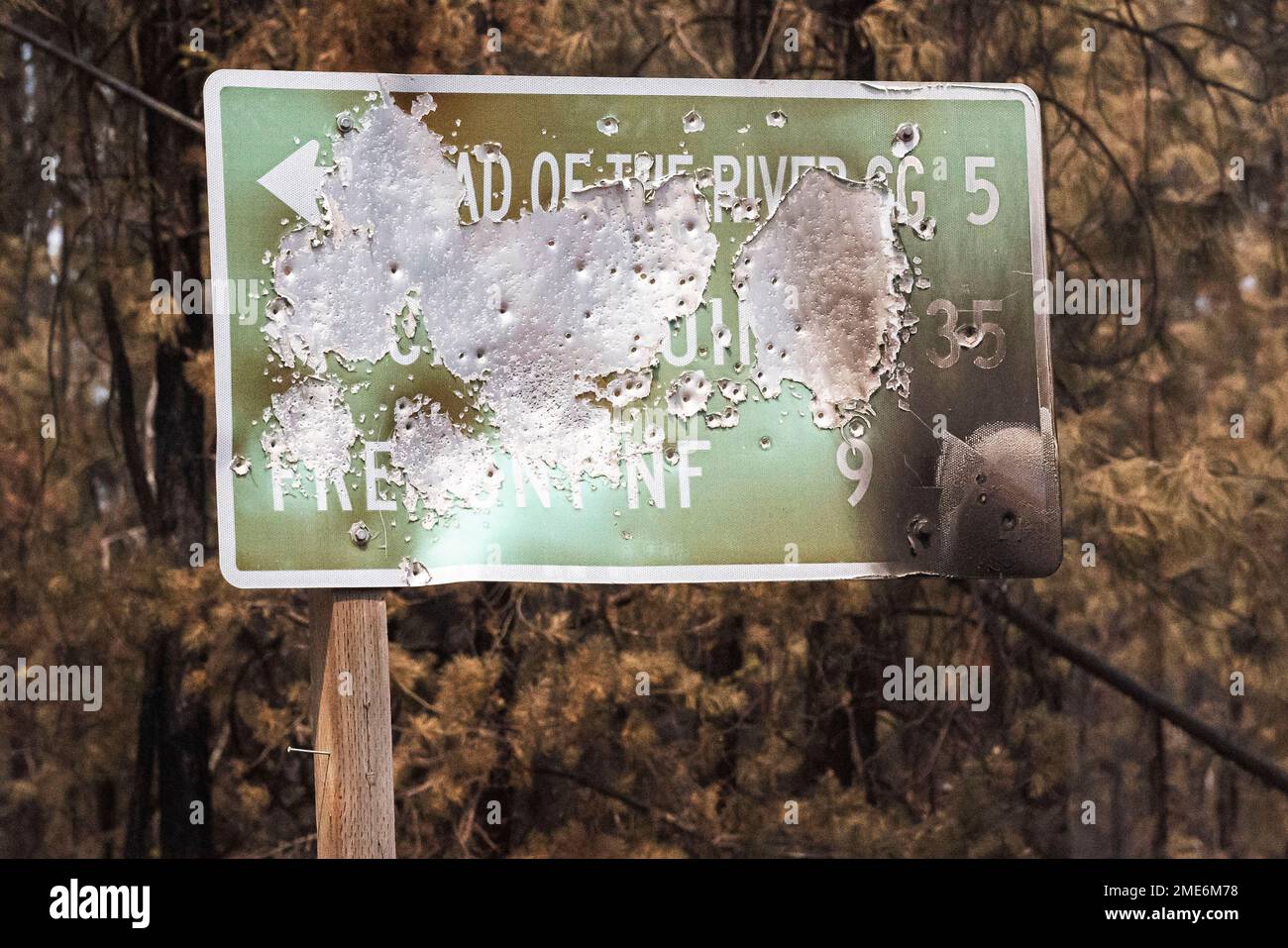 A road sign is seen charred on the North East side of the Bootleg Fire ...