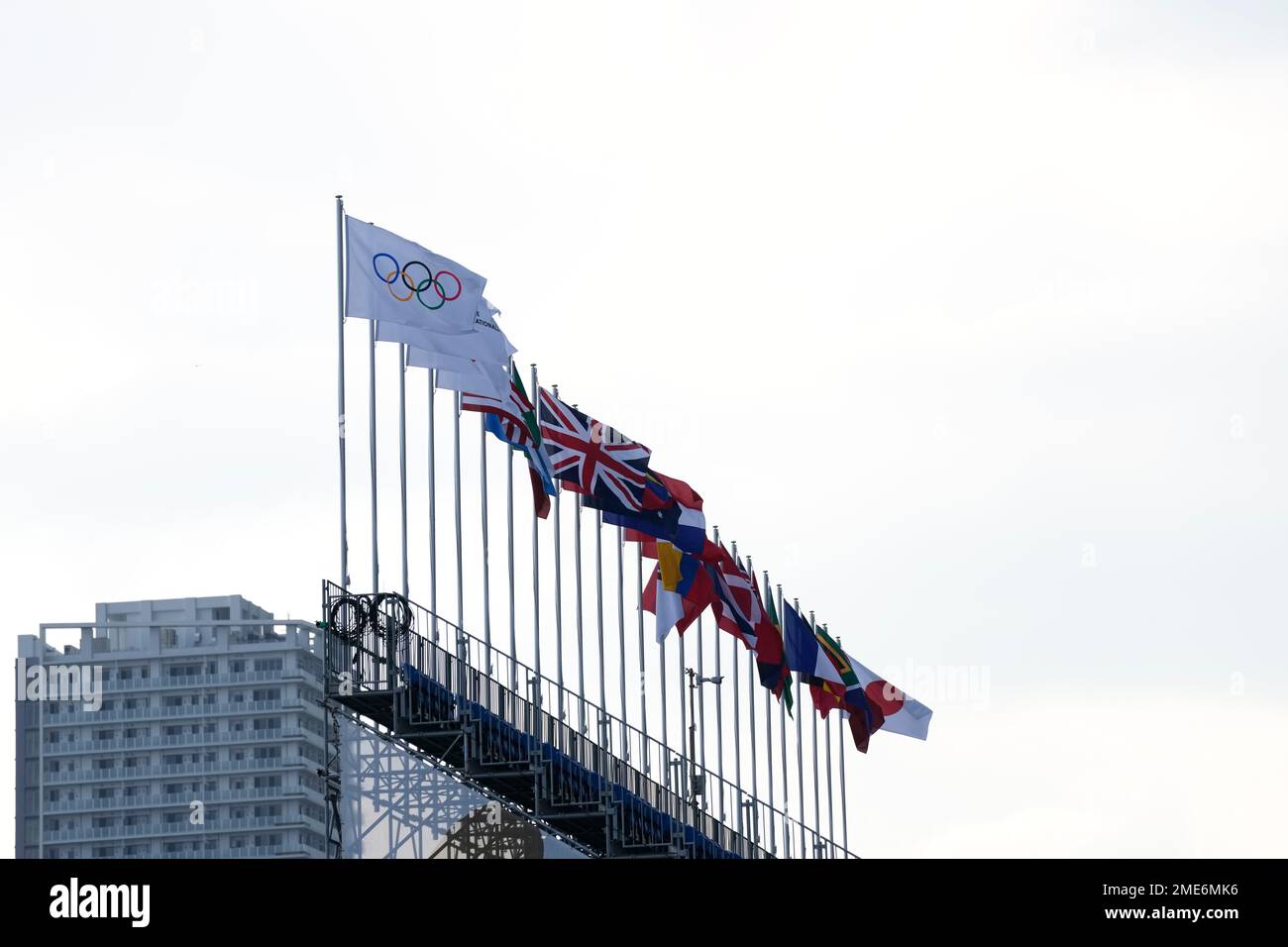 Olympic flag and flags of various participating countries fly over ...