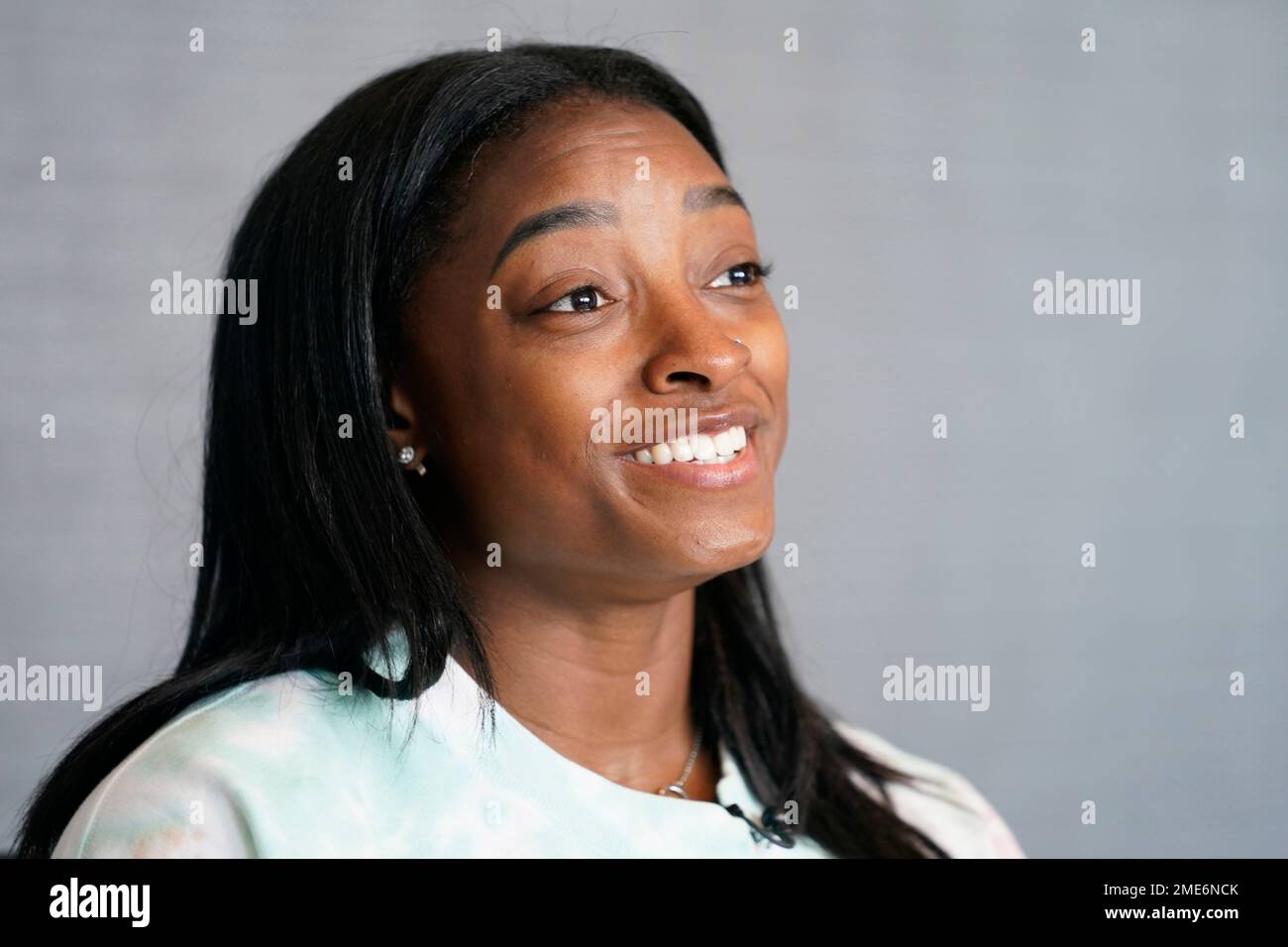 Simone Biles smiles during an interview before a United Airlines send ...
