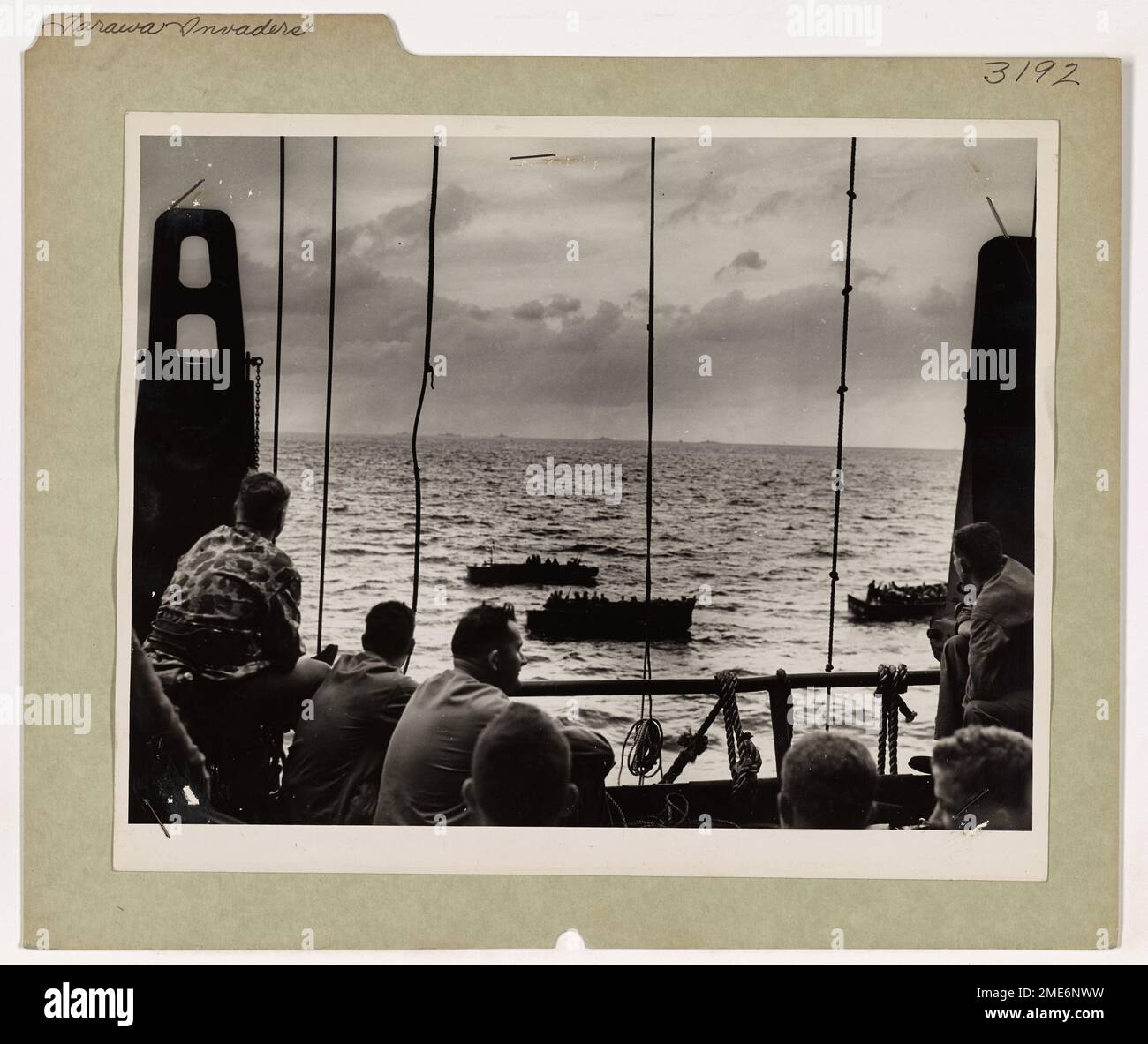 U.S. Marines aboard a Coast Guard-manned combat transport wait for the ...