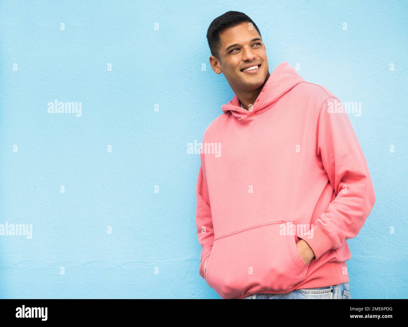 Happy, casual and man in studio thinking, relax and normal against a ...